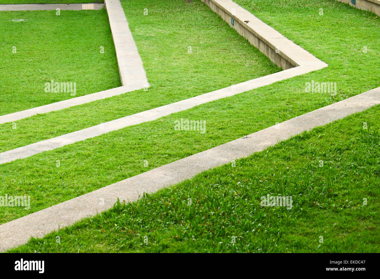 Step path on a garden surrounded with grass Stock Photo - Alamy