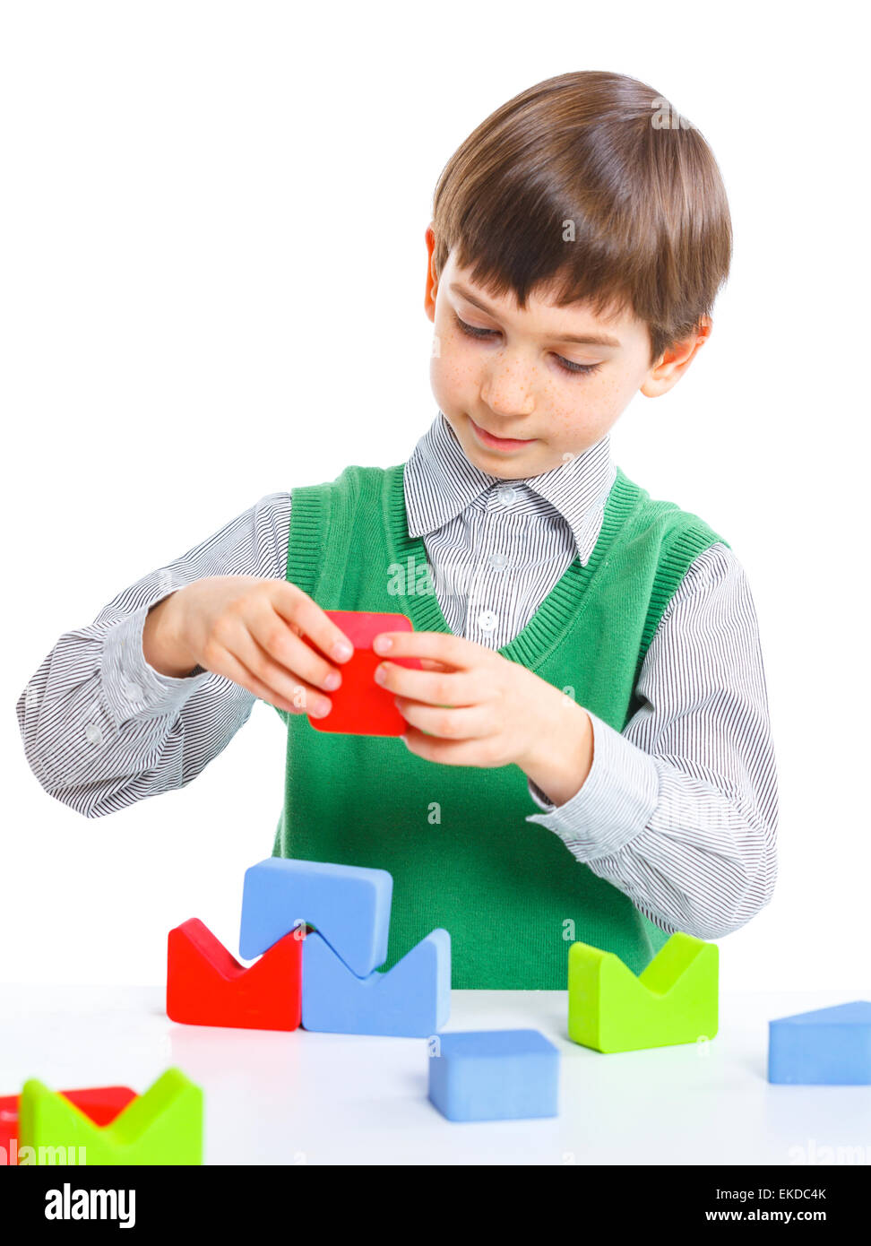 smiling little boy is building Stock Photo - Alamy