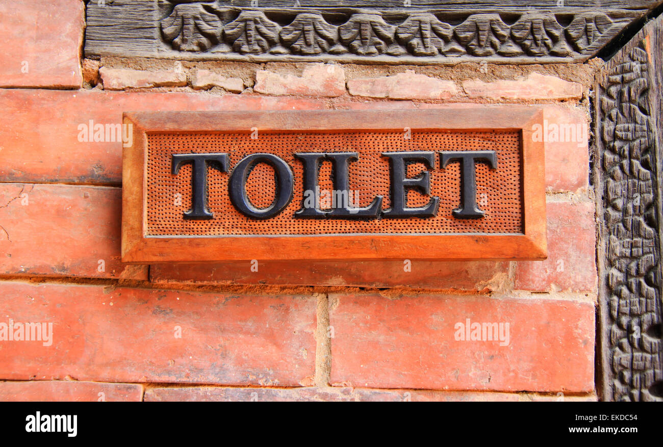 Ancient toilet sign on brick wall Stock Photo - Alamy