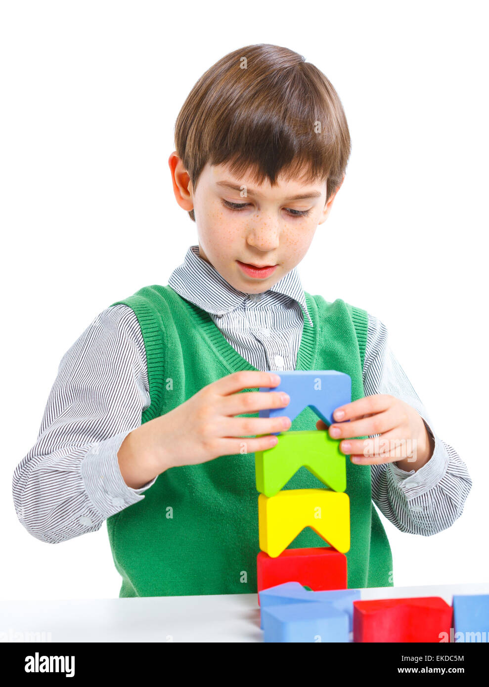 smiling little boy is building Stock Photo - Alamy