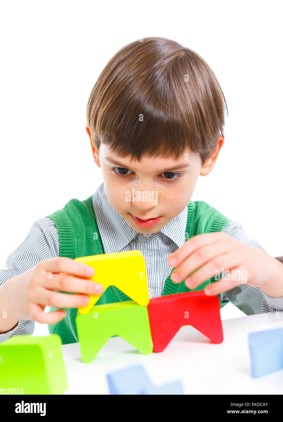 smiling little boy is building Stock Photo - Alamy