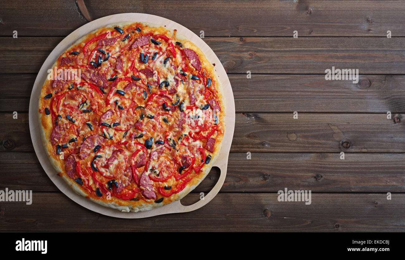 Freshly Baked Pepperoni Pizza with Black Olives, Tomatoes and Spices ...