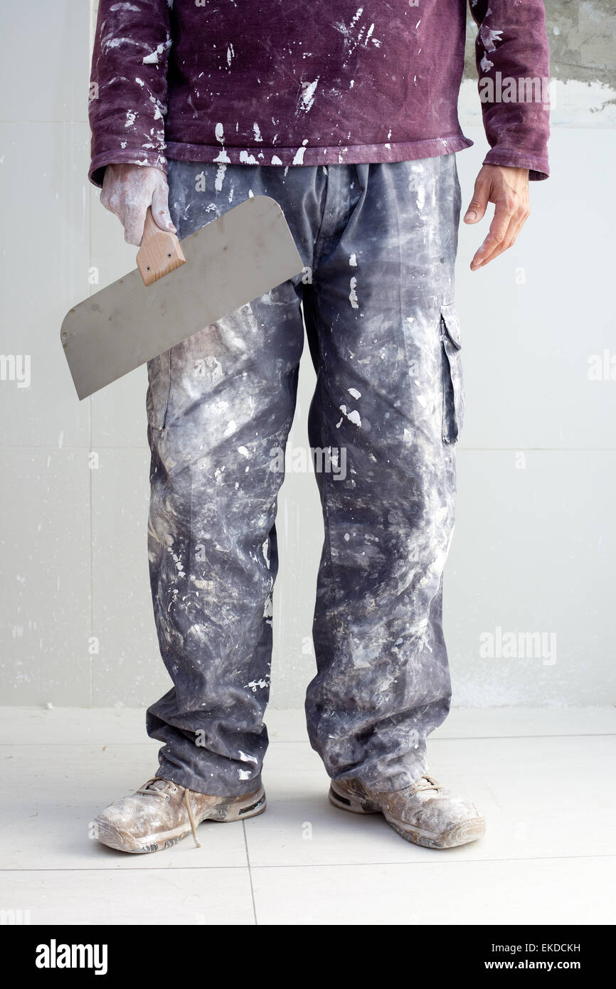 construction plaster plaster man dirty trousers Stock Photo - Alamy