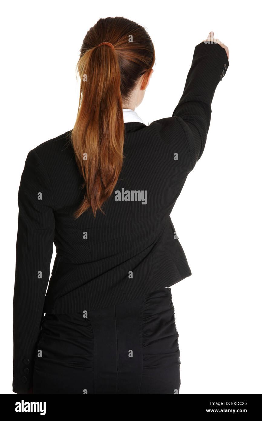 Young business woman pointing at something Stock Photo - Alamy