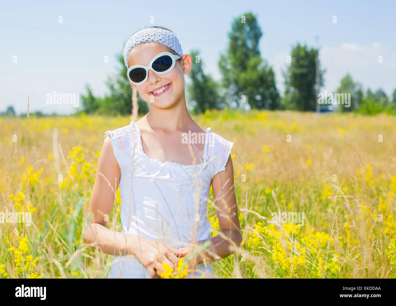 Girl in field Stock Photo - Alamy