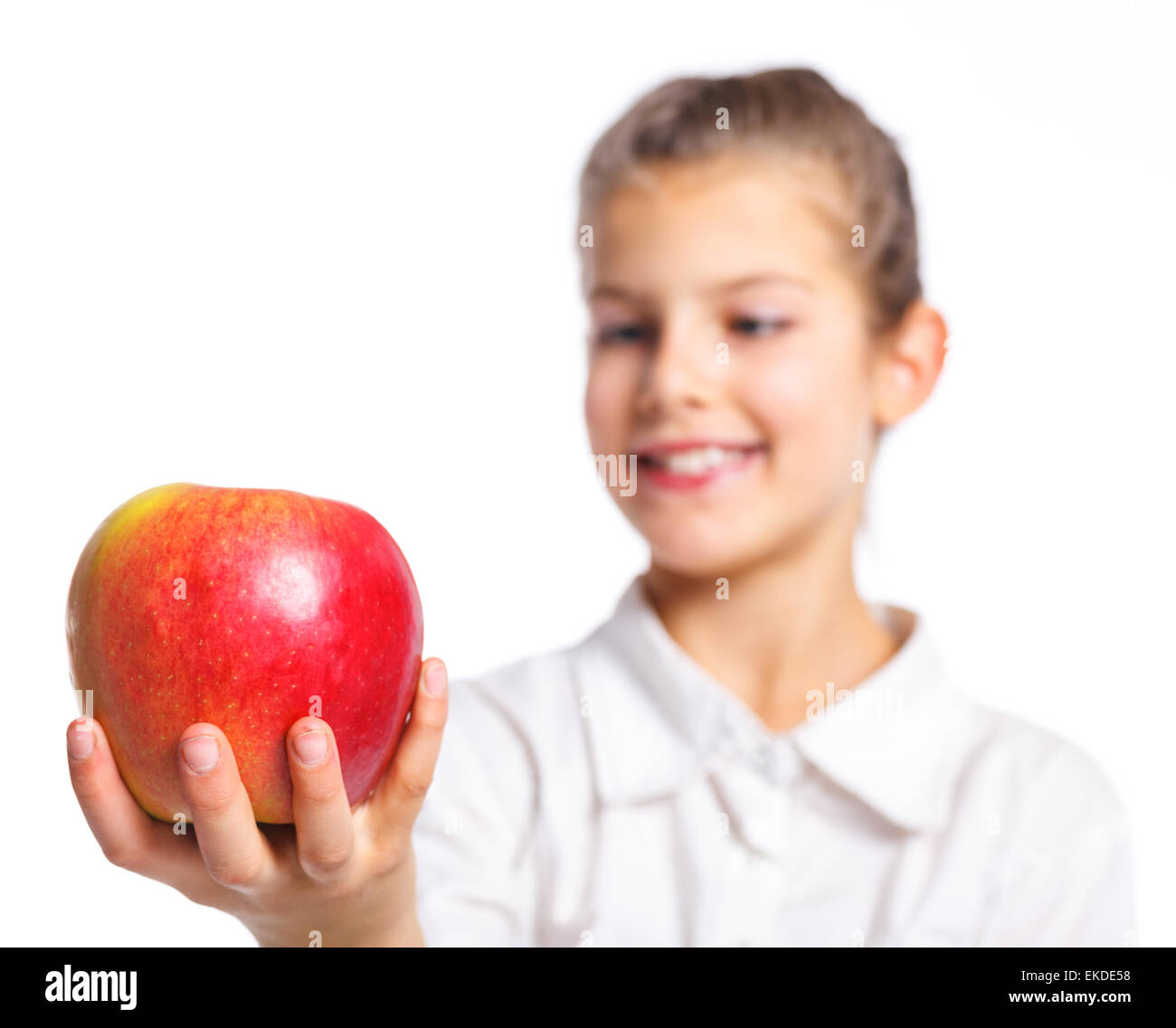 Portrait of cute girl with apple Stock Photo - Alamy