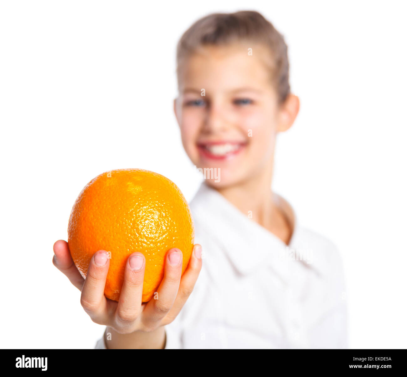 Portrait of cute girl with orange Stock Photo - Alamy