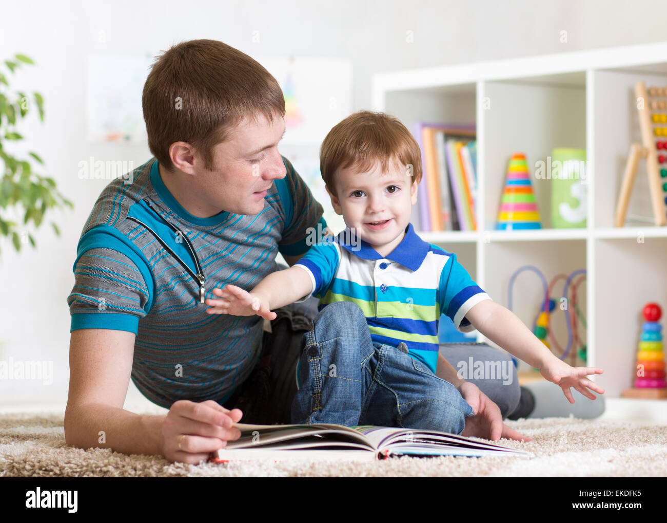 happy father read a book to child Stock Photo - Alamy