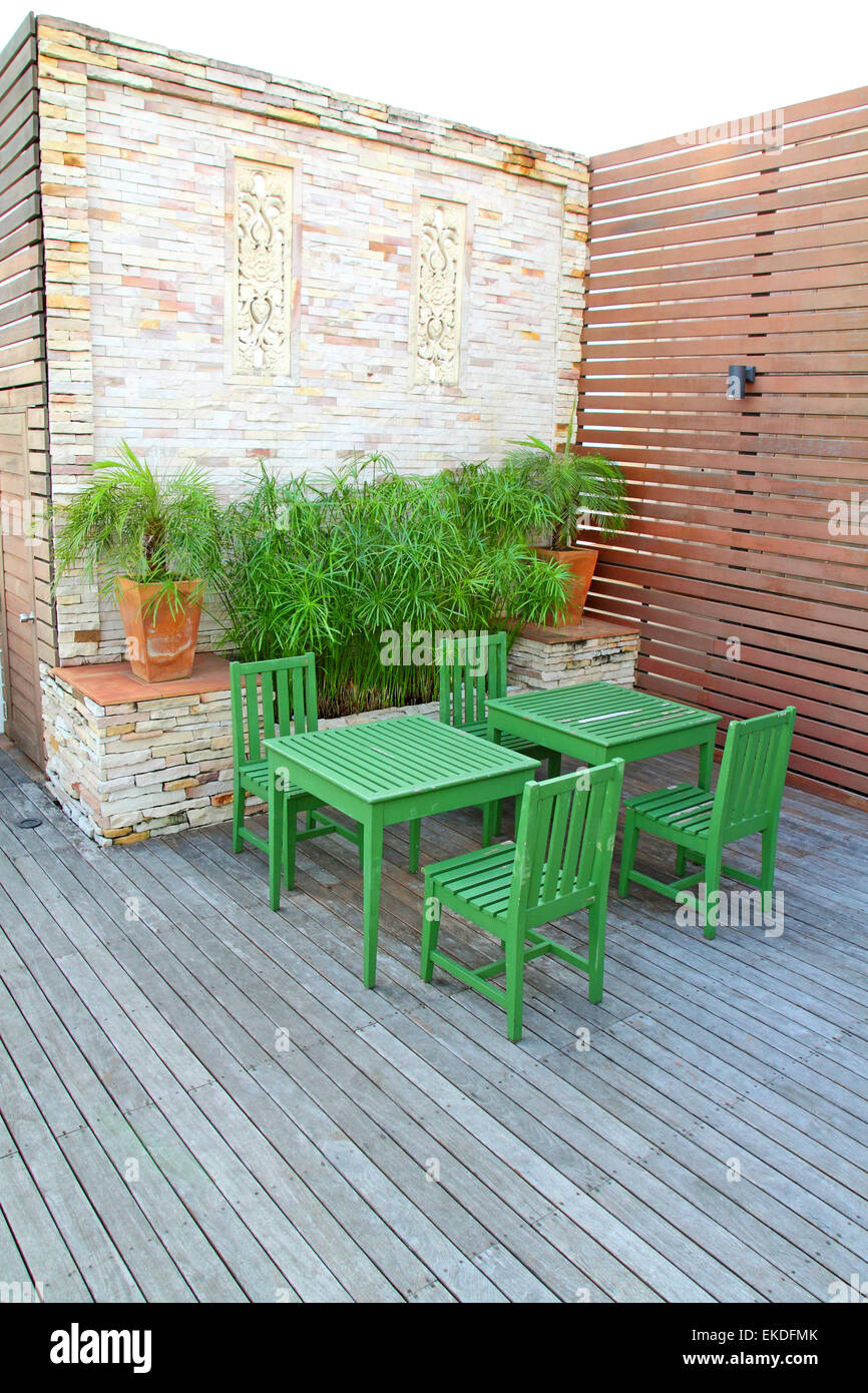 Green table setting on rooftop outdoor Stock Photo - Alamy