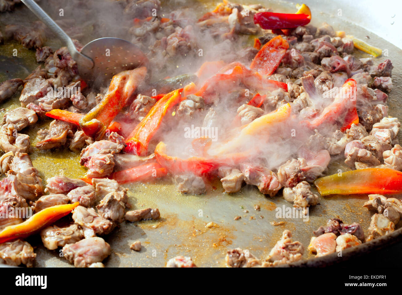 Paella from Spain first steps cooking big pan Stock Photo - Alamy
