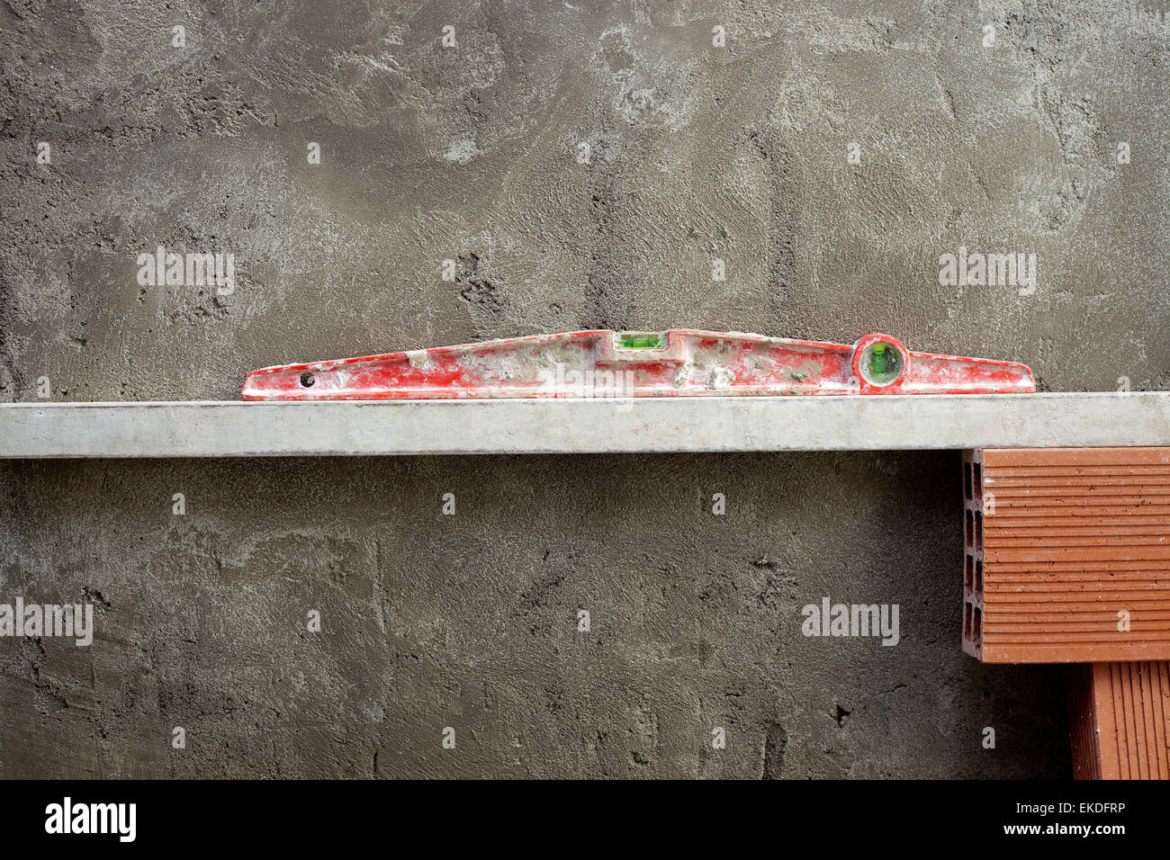 bubble spirit level tool in red on costruction cement Stock Photo - Alamy