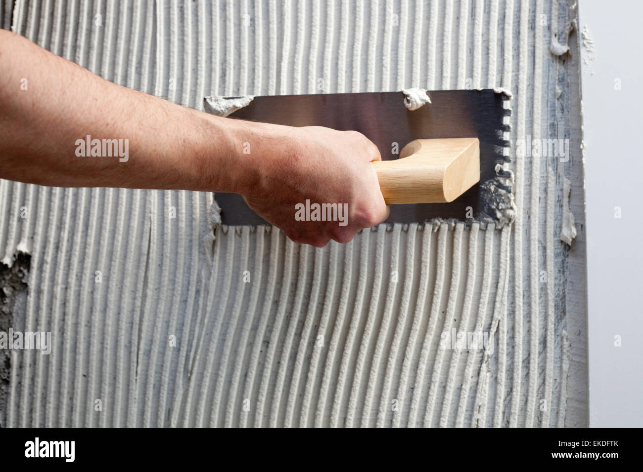 construction notched trowel with white cement Stock Photo - Alamy