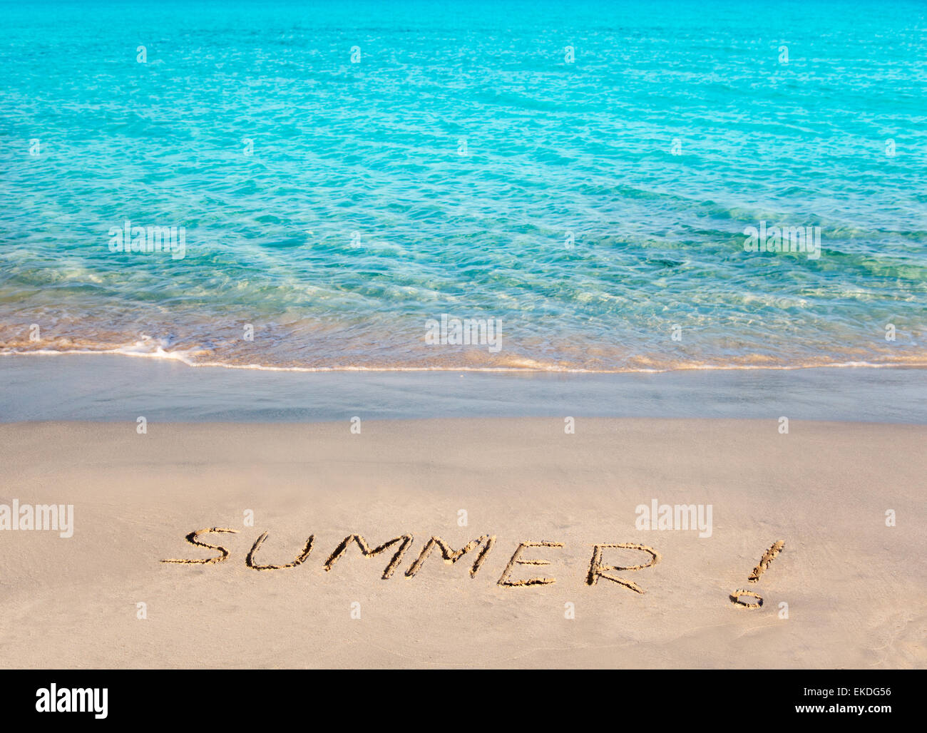 Tropical beach with Summer word written in sand Stock Photo - Alamy