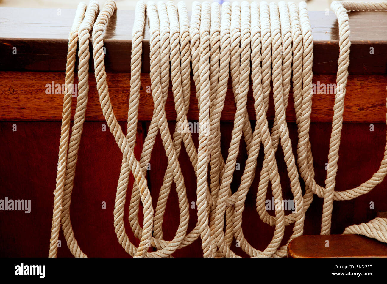 Marine ropes in a row on vintage wooden boat Stock Photo - Alamy