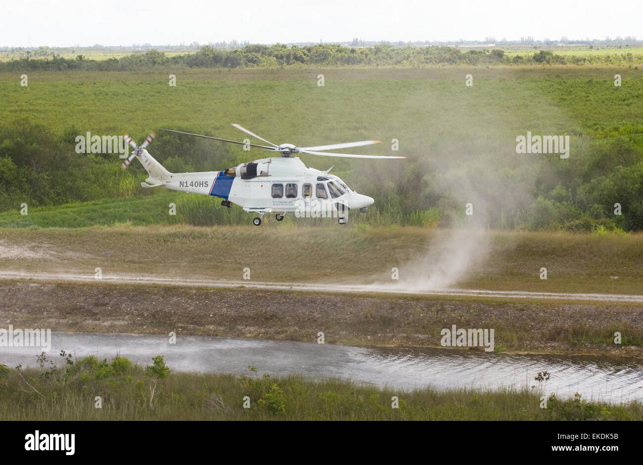 A U.S. Customs and Border Protection helicopter lands in a remote area ...