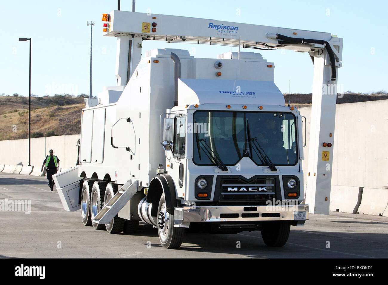 A CBP officer monitors the Vehicle and Cargo Inspection System (VACIS ...