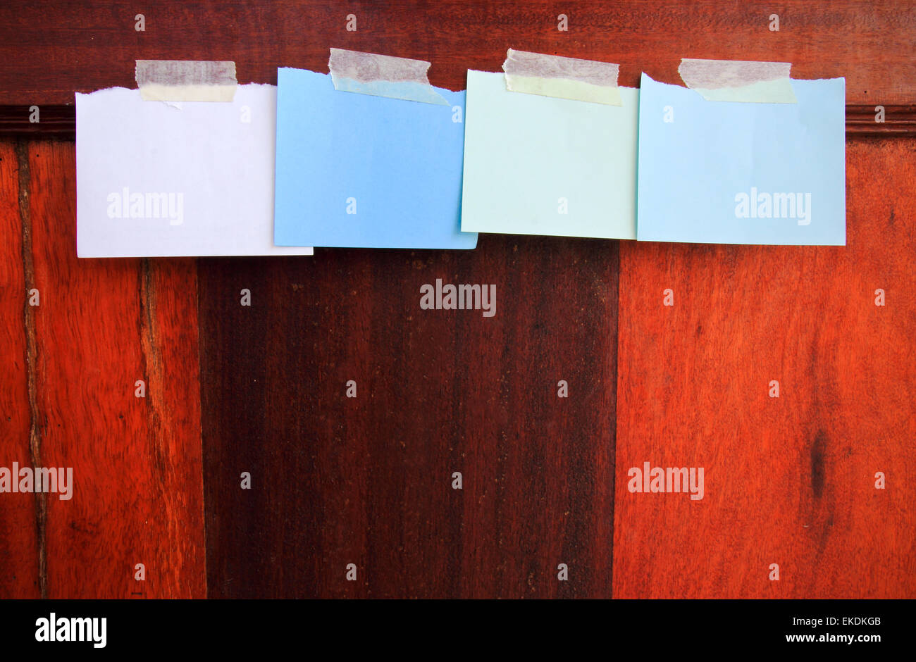 Notepaper attach with tape on wooden wall Stock Photo - Alamy