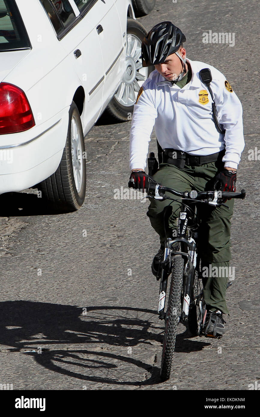 CBP Border Patrol agent bike patrols area at the Nogales port of entry ...