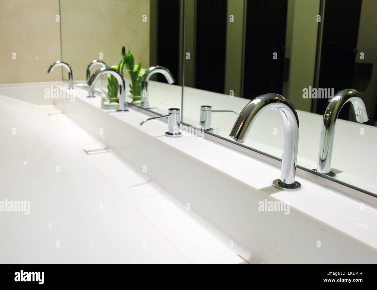 sinks and taps in a public toilet Stock Photo - Alamy