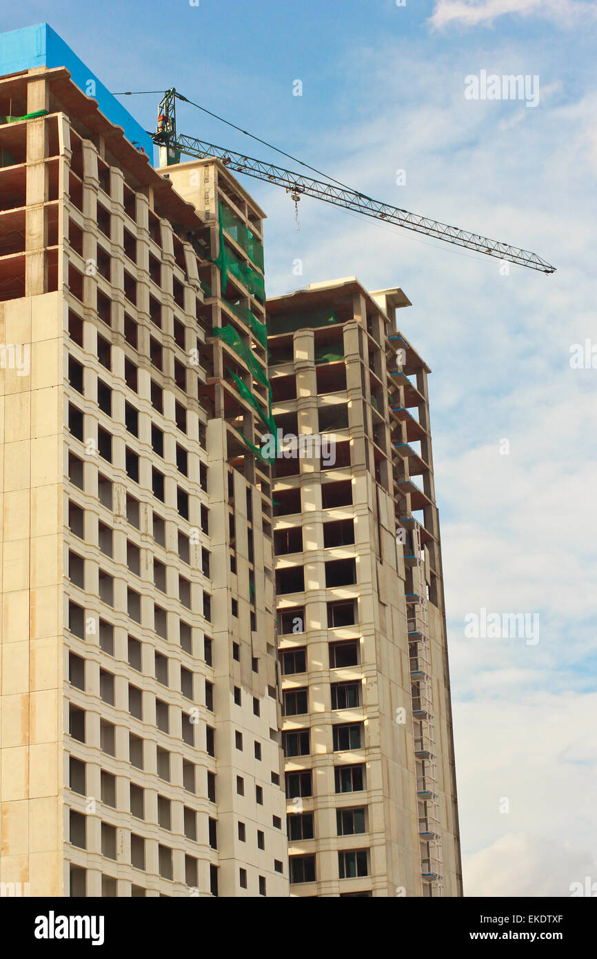 Under construction building with blue sky Stock Photo - Alamy