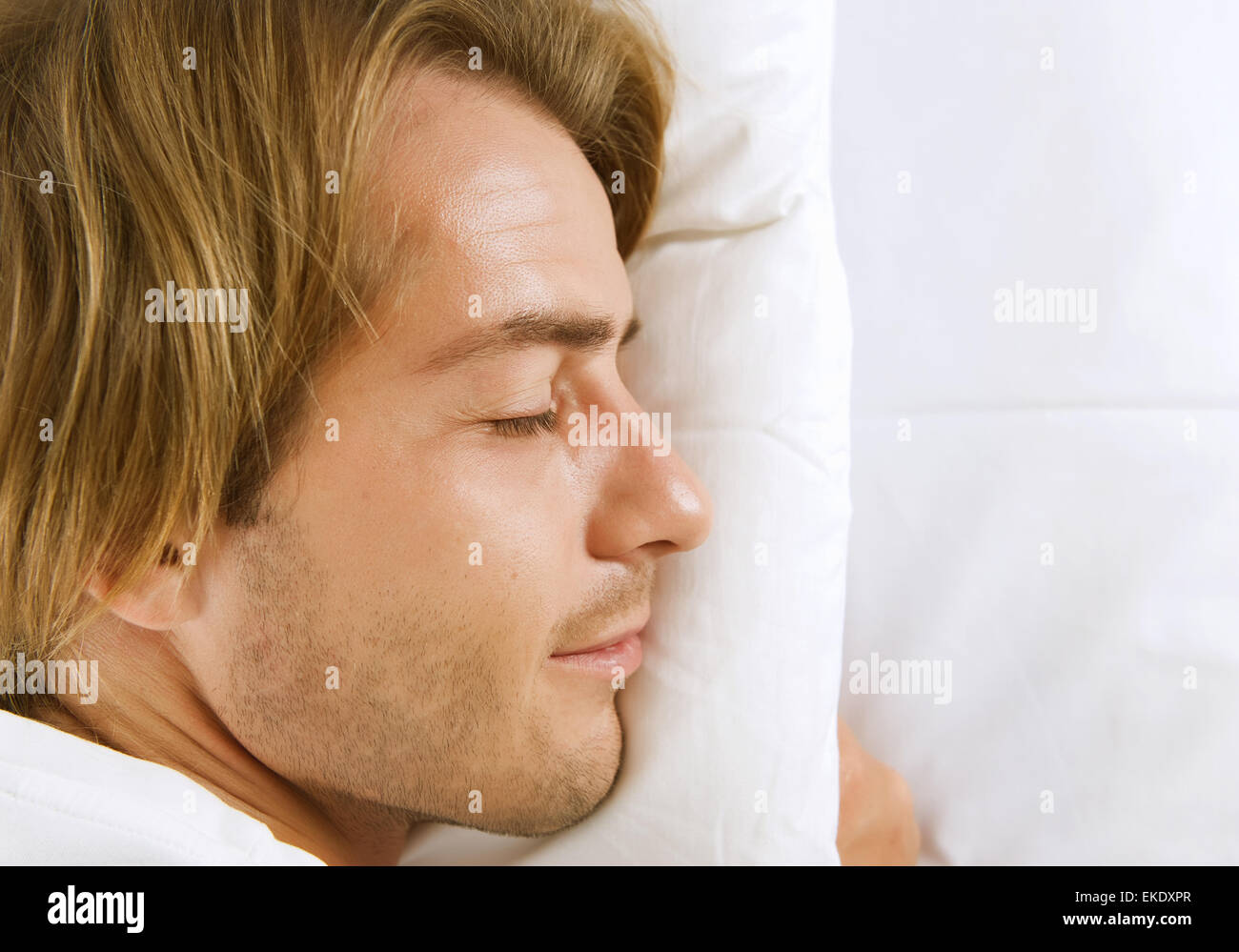 Young Man Sleeping in his Bed Stock Photo - Alamy