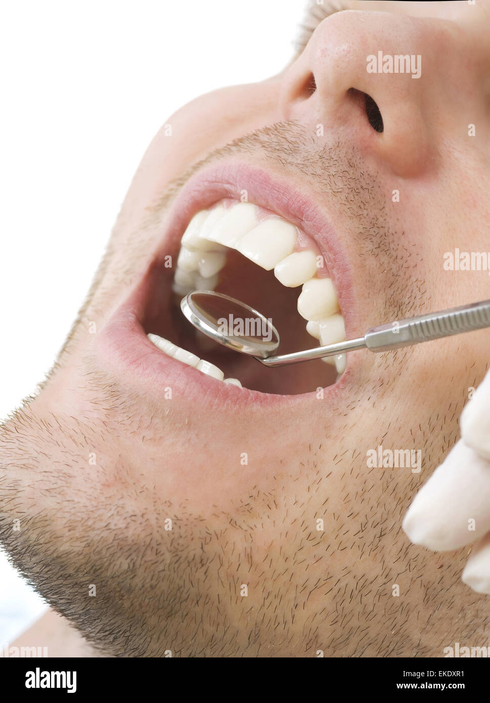 Examining patient's teeth Stock Photo - Alamy
