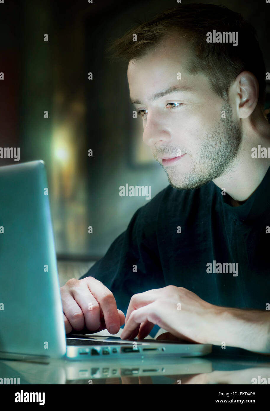 Young Man With Laptop Stock Photo - Alamy