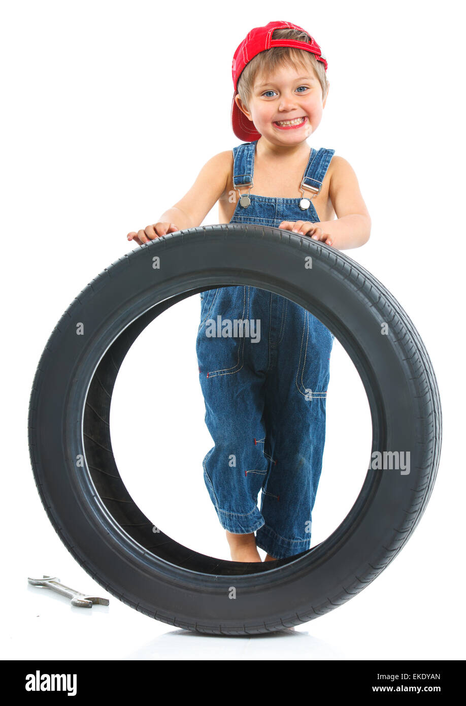 Little mechanic with a tire Stock Photo - Alamy