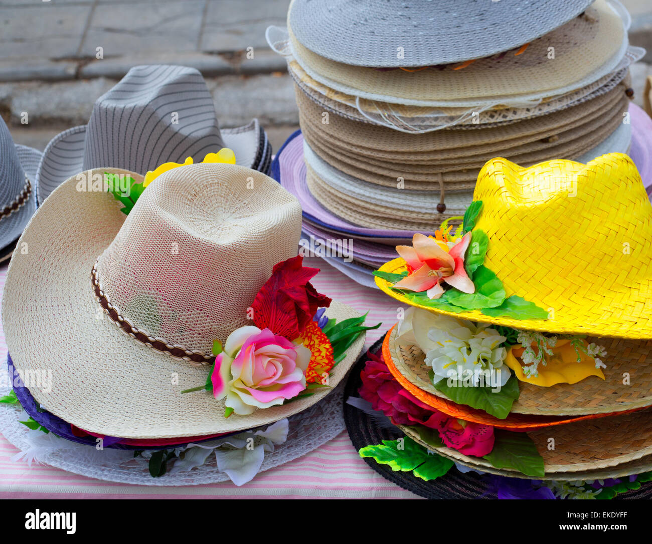 Colorful straw hats stacked in an outdoor Stock Photo - Alamy
