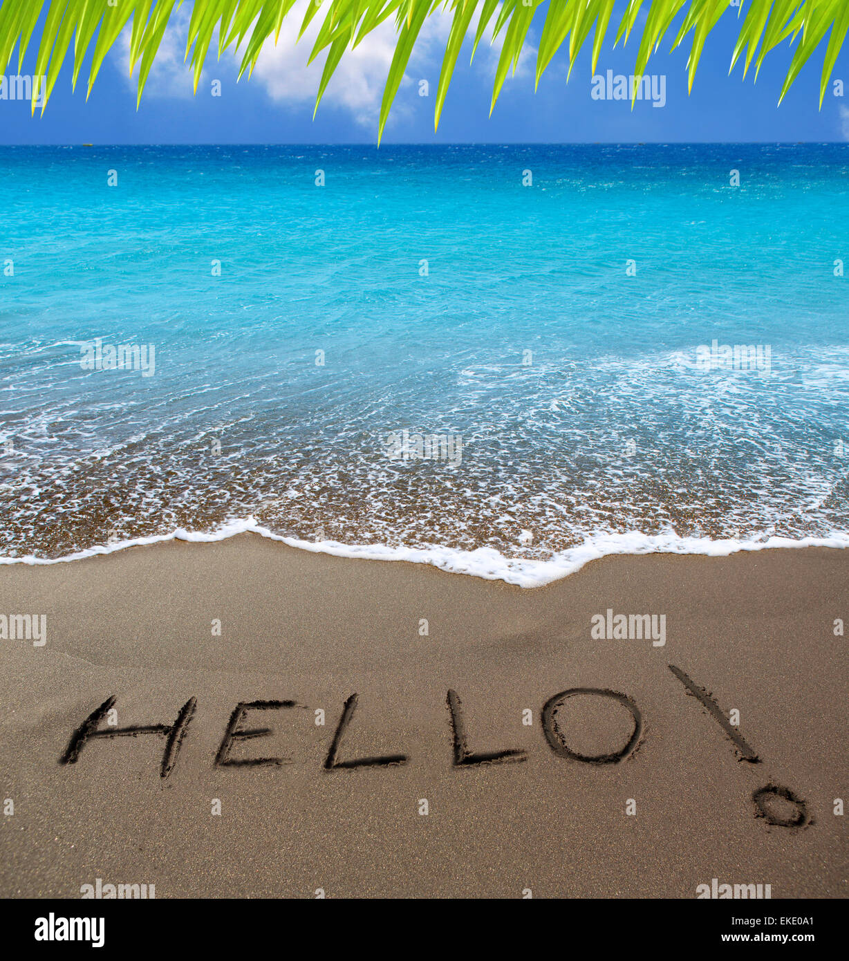 Brown sand beach with written word Hello Stock Photo - Alamy