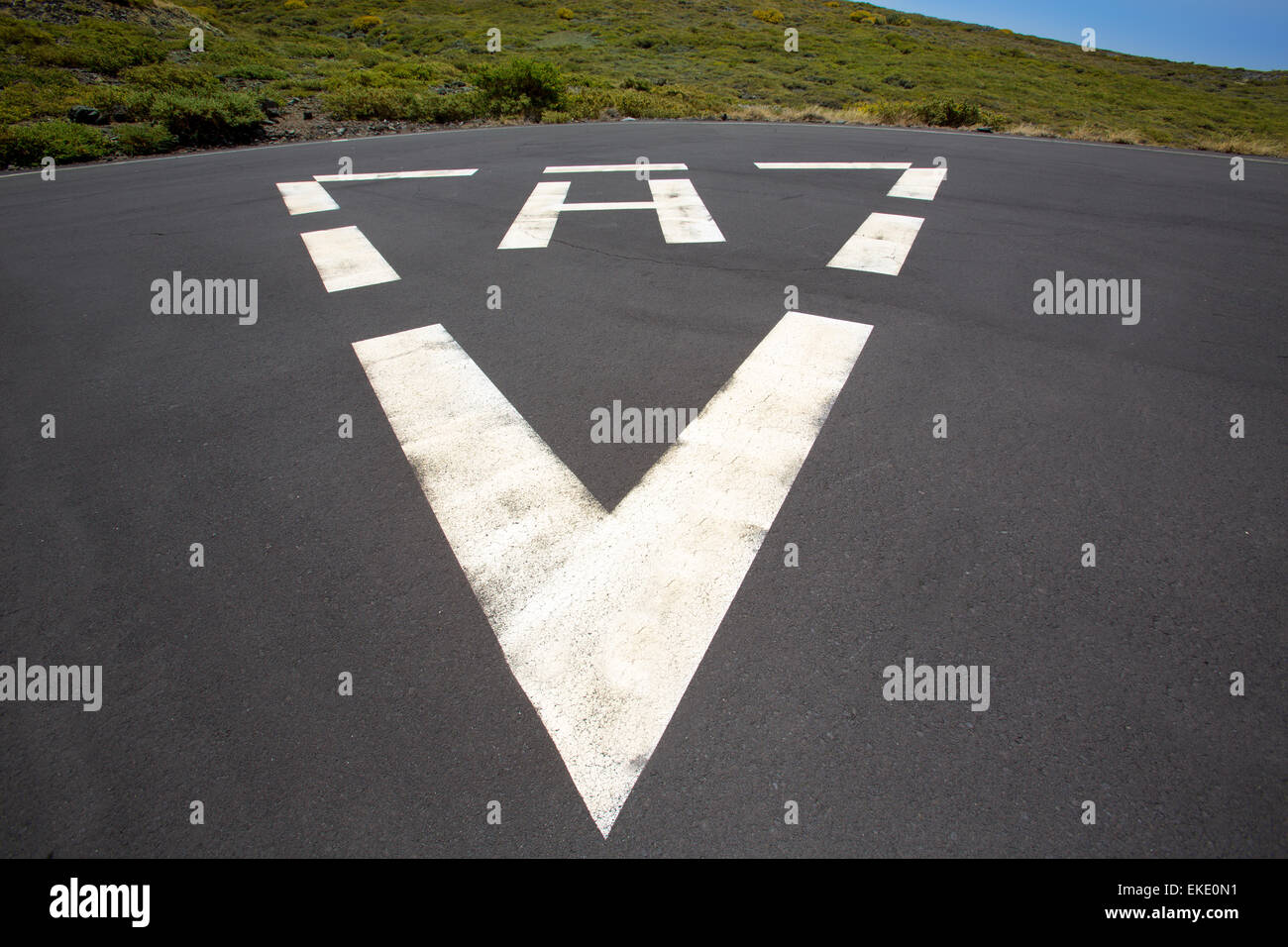 heliport triangle white soil painted sign Stock Photo - Alamy