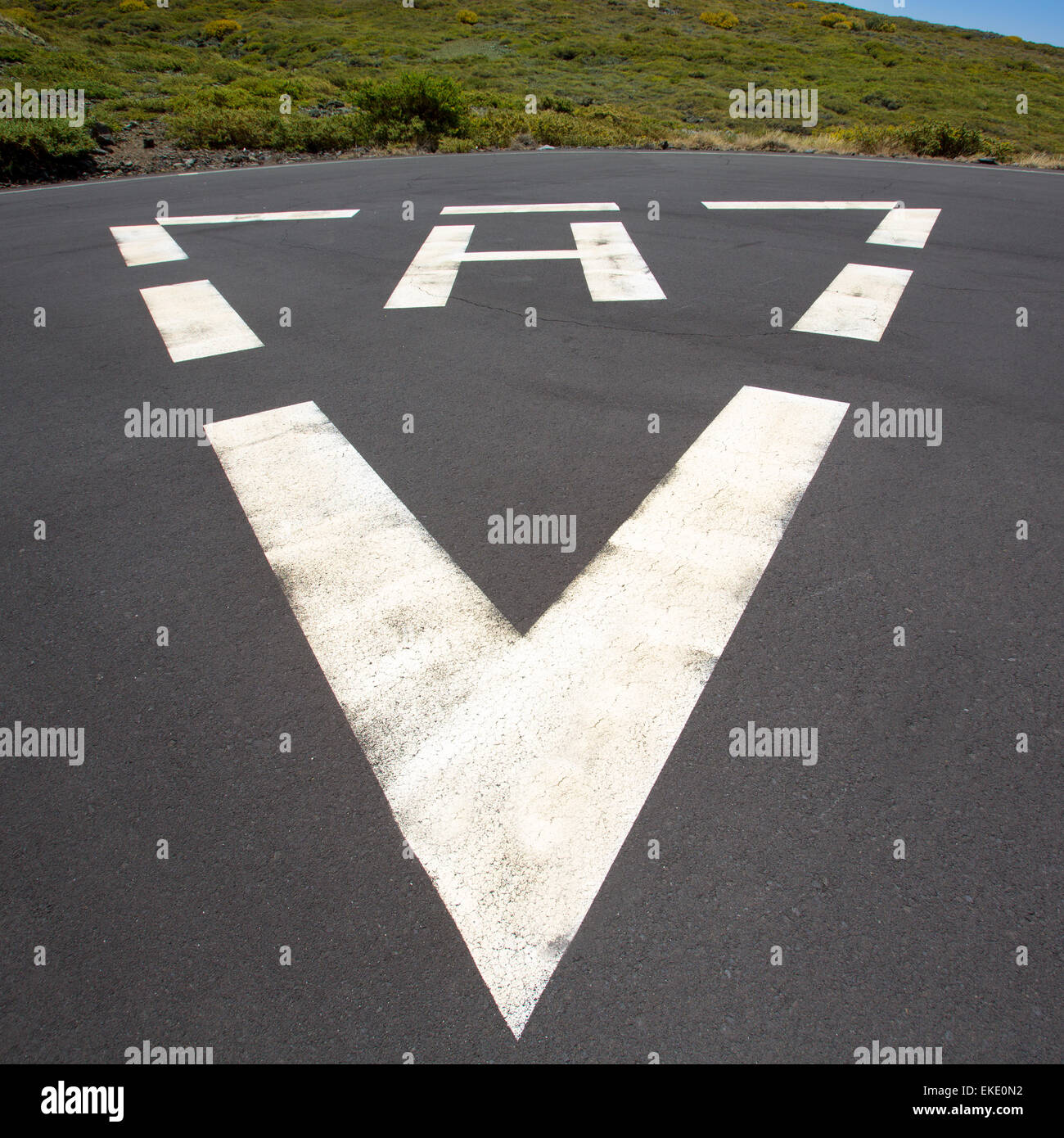 heliport triangle white soil painted sign Stock Photo - Alamy