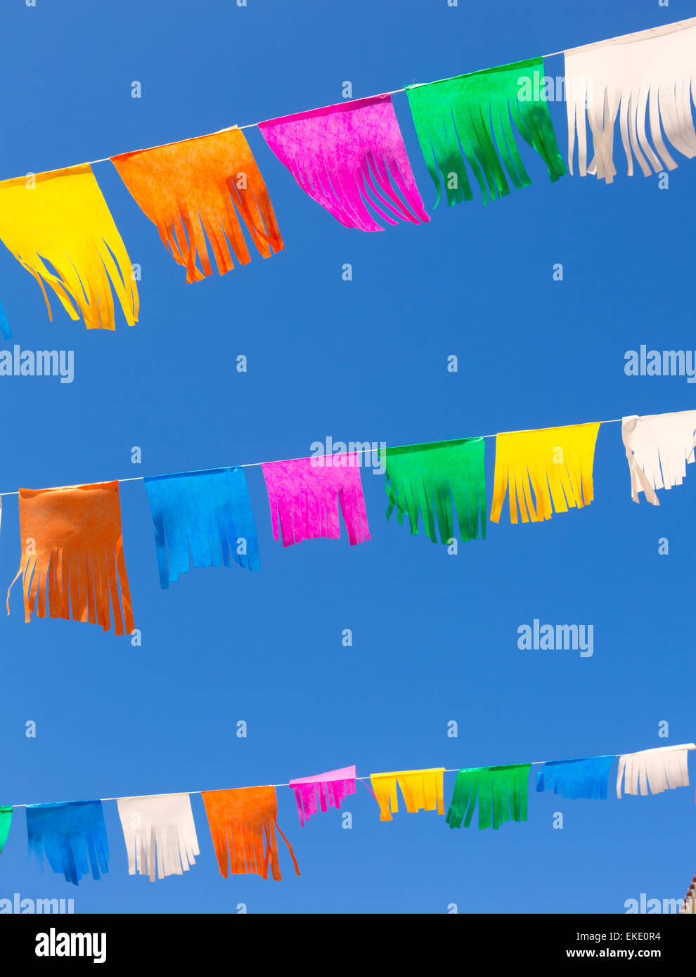 colorful tissue Paper fringe garland under blue sky Stock Photo - Alamy