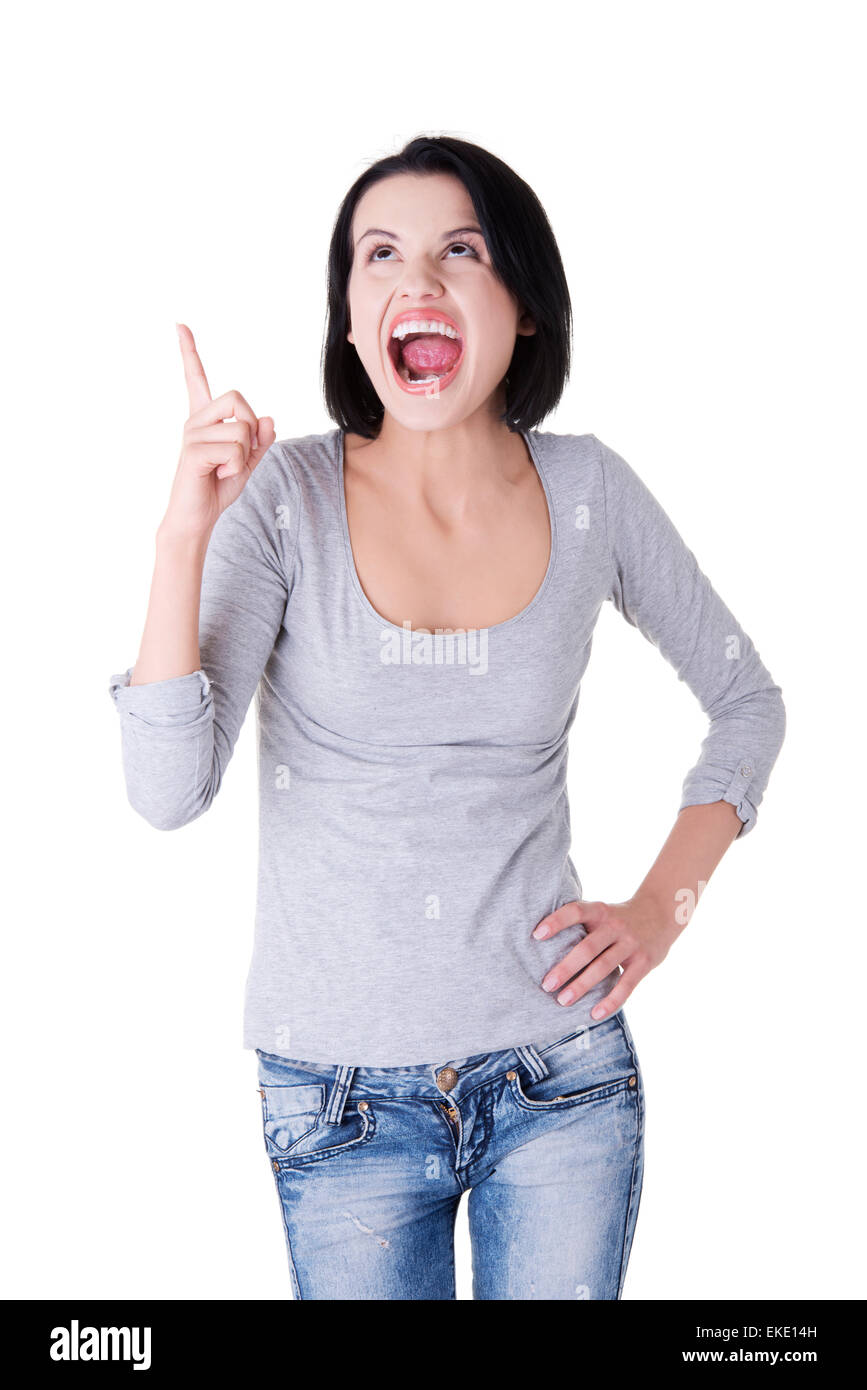Surprised woman screaming and pointing at copy space Stock Photo - Alamy