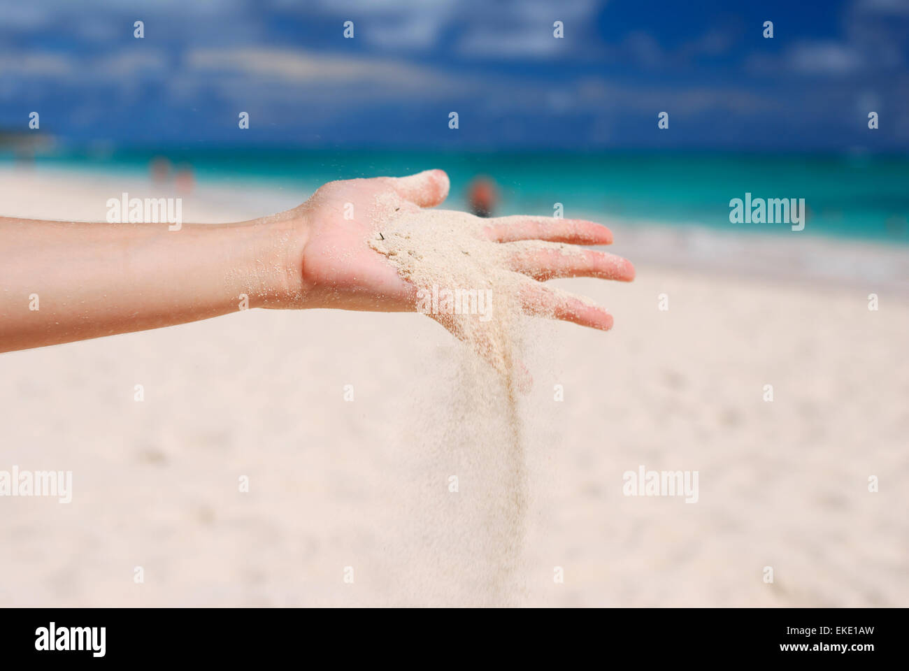 Sand in hand Stock Photo - Alamy