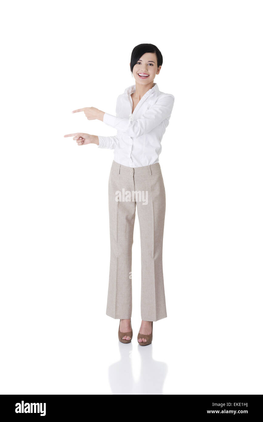 Beautiful business woman showing copy space Stock Photo - Alamy