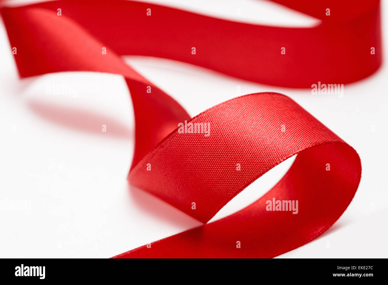 Shiny red satin ribbon Stock Photo - Alamy