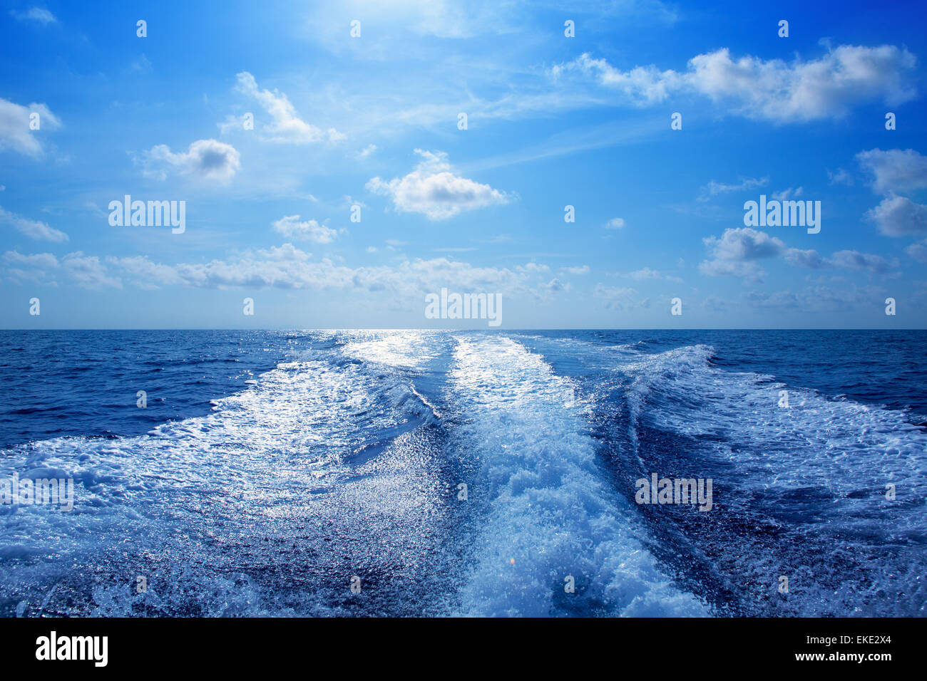 Boat wake prop wash foam in blue sky Stock Photo - Alamy