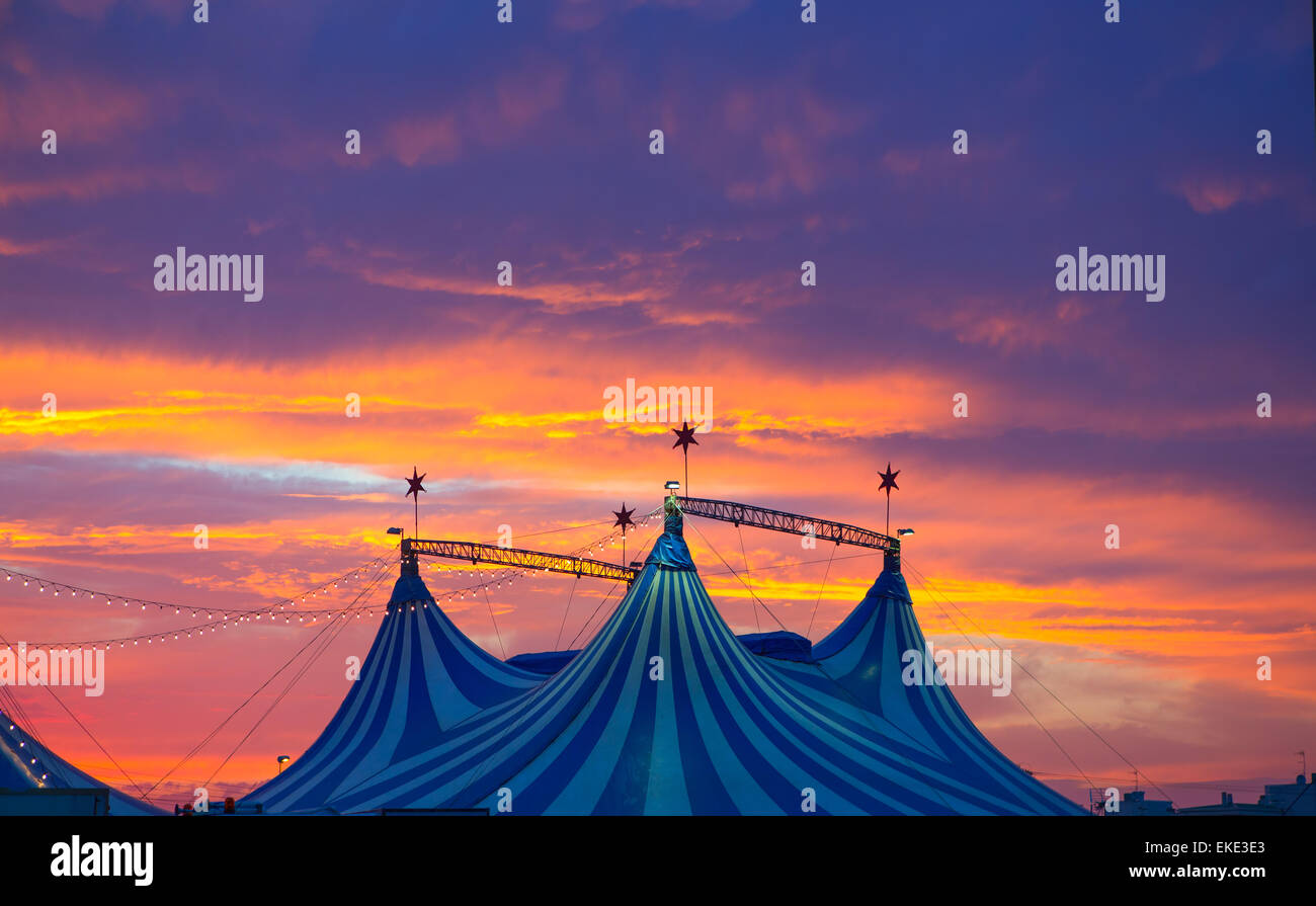 Circus tent in a dramatic sunset sky colorful Stock Photo - Alamy