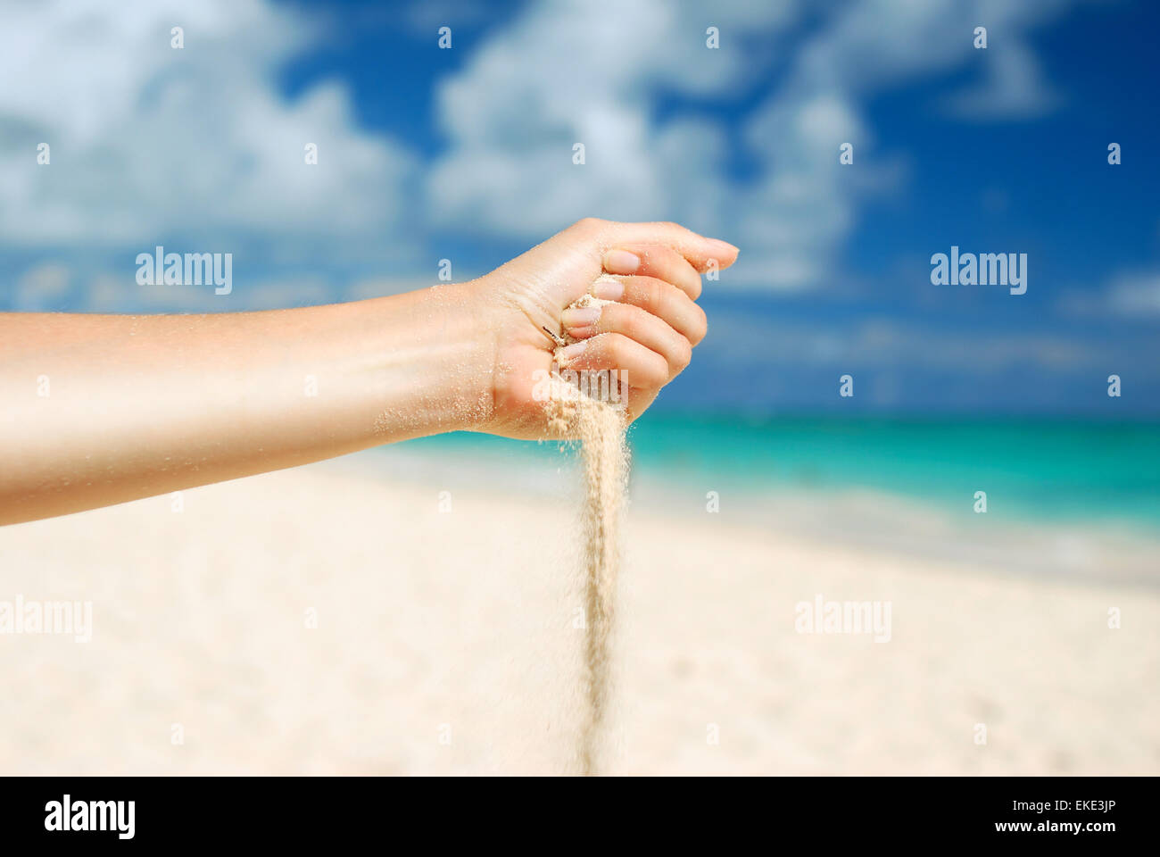 Sand in hand Stock Photo - Alamy