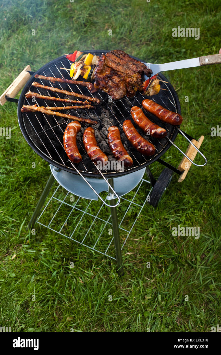 Cooking on the barbecue grill Stock Photo - Alamy