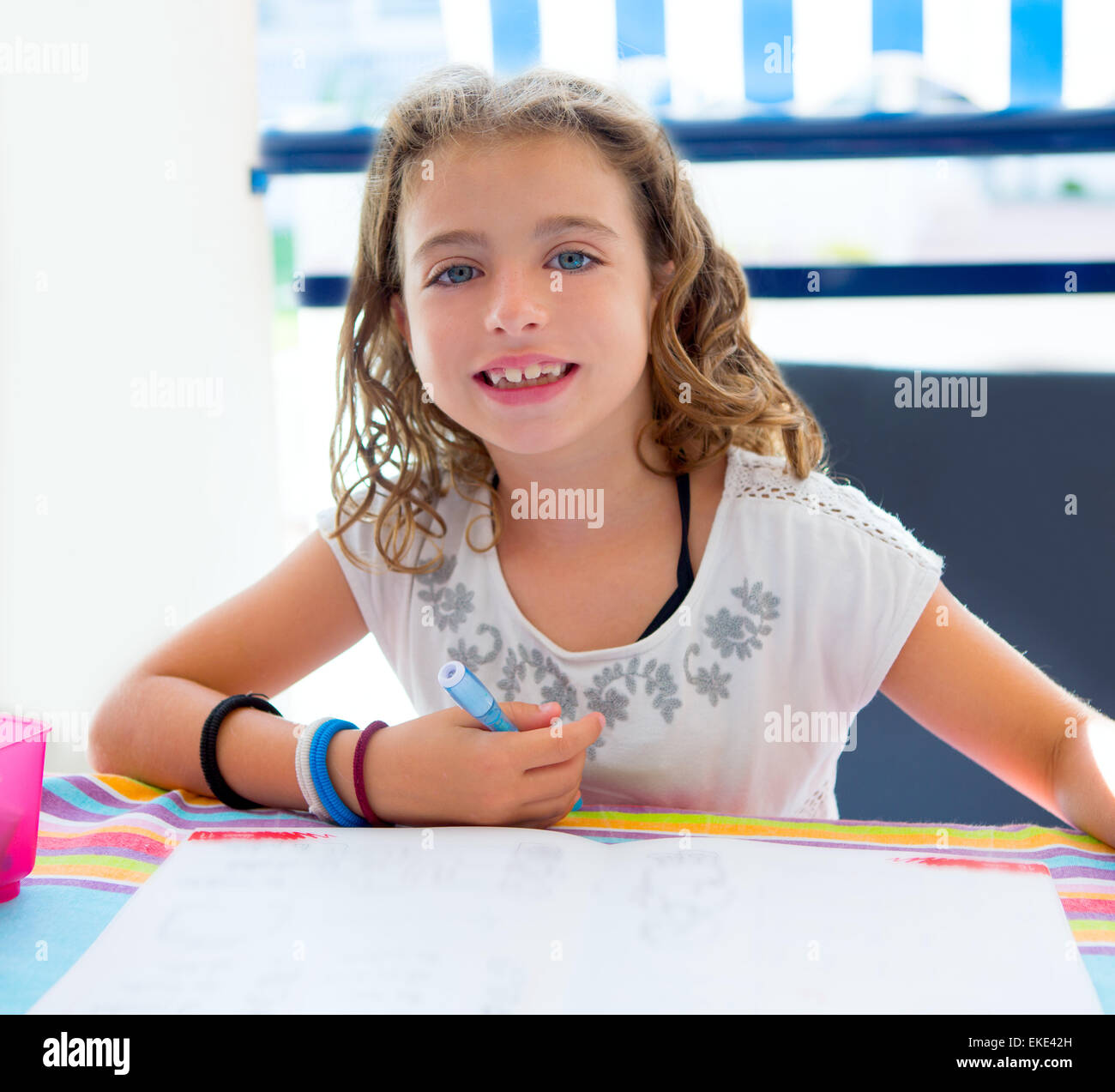children kid girl smiling with homework in summer Stock Photo - Alamy