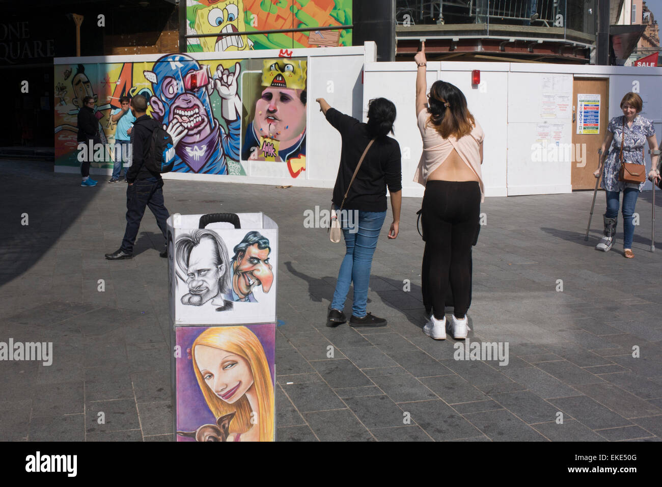 Street portrait caricatures and construction artwork faces in Leicester ...
