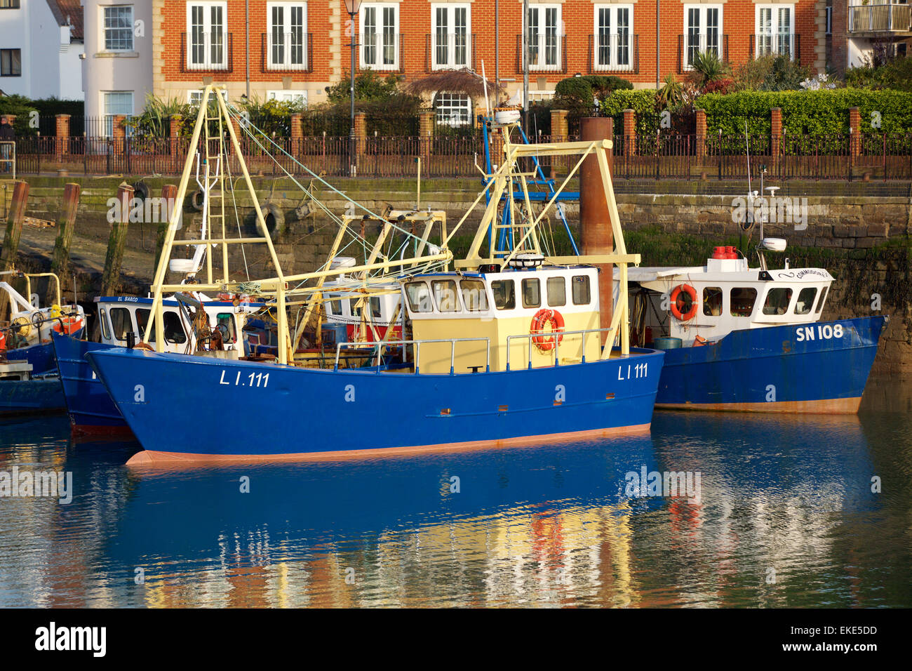 Freshly painted fishing boat moored in the Camber Docks old Portsmouth ...