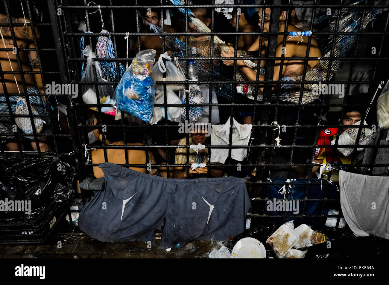 Mara gang members are seen behind the bars of overcrowded cells at the ...