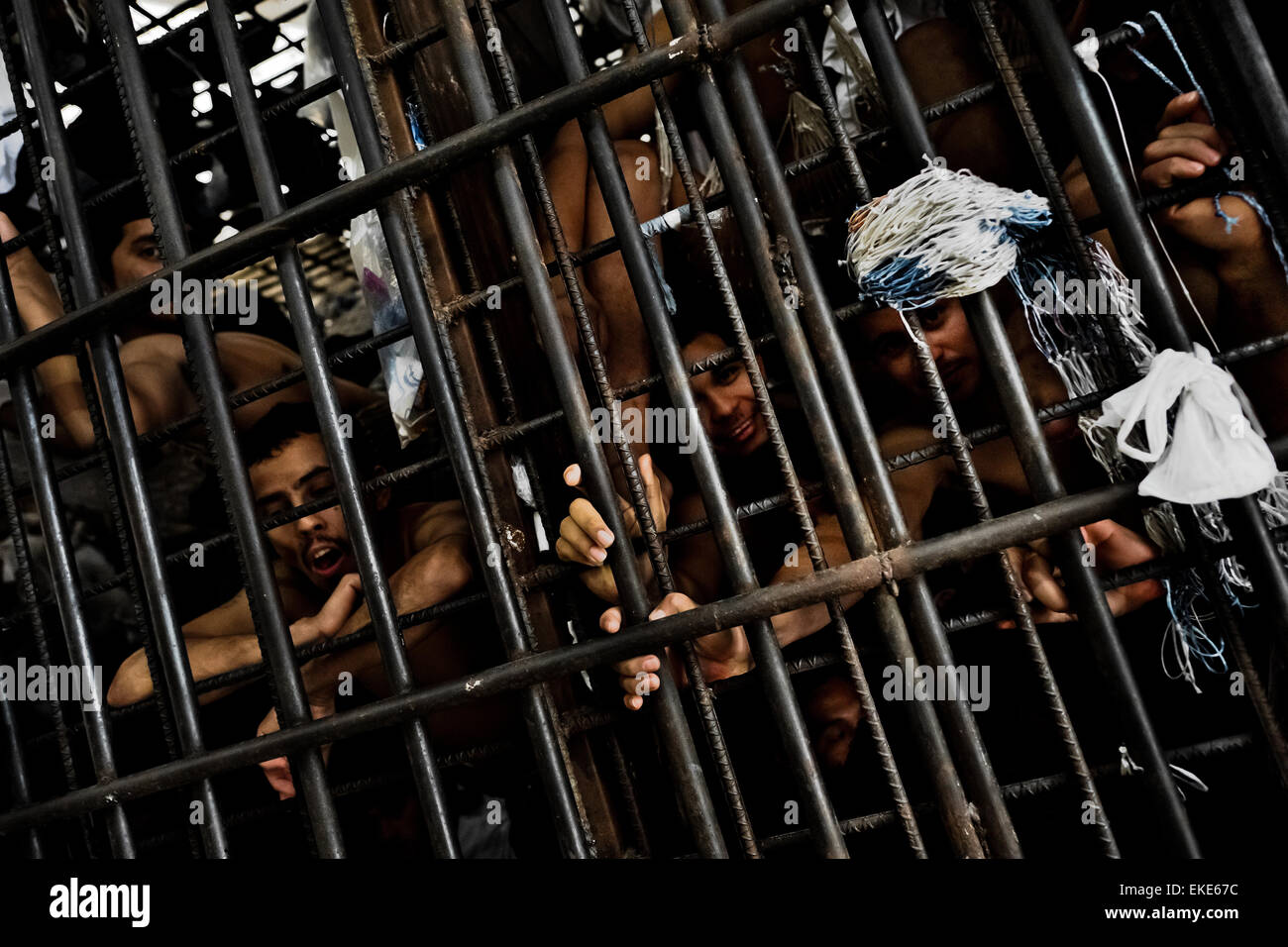 Mara gang members are seen behind the bars of overcrowded cells at the ...