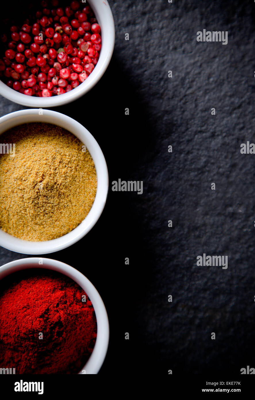 Assorted spices on stone background Stock Photo - Alamy