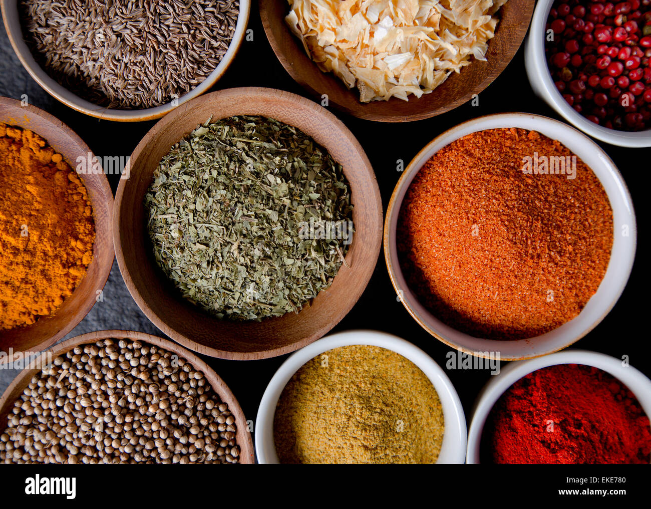 Assorted spices on stone background Stock Photo - Alamy