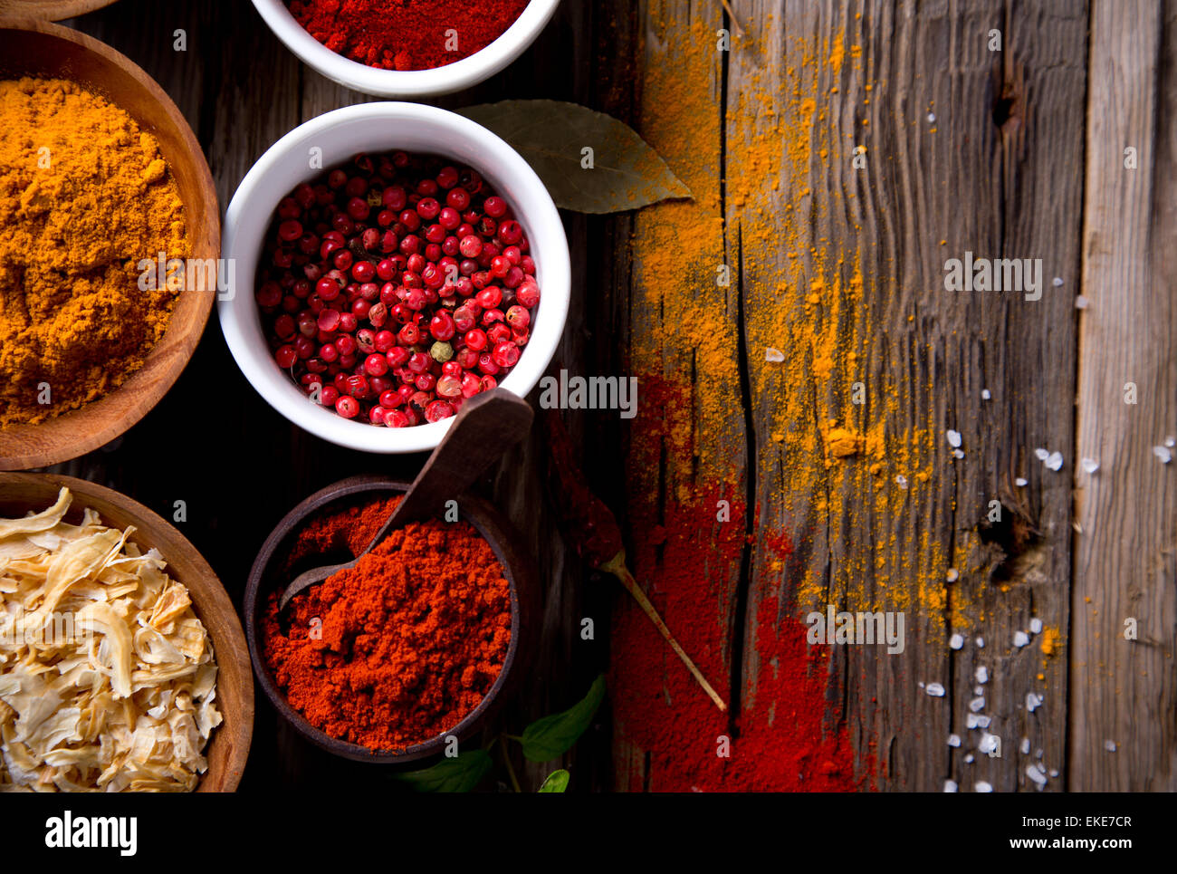 Assorted spices on wooden background Stock Photo - Alamy