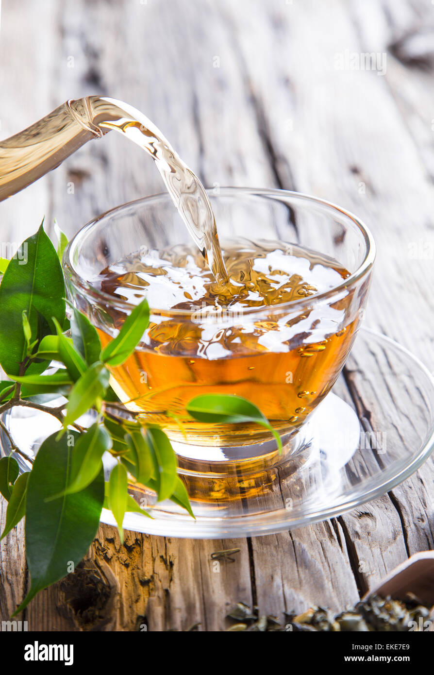 Transparent cup of green tea on wooden background Stock Photo - Alamy